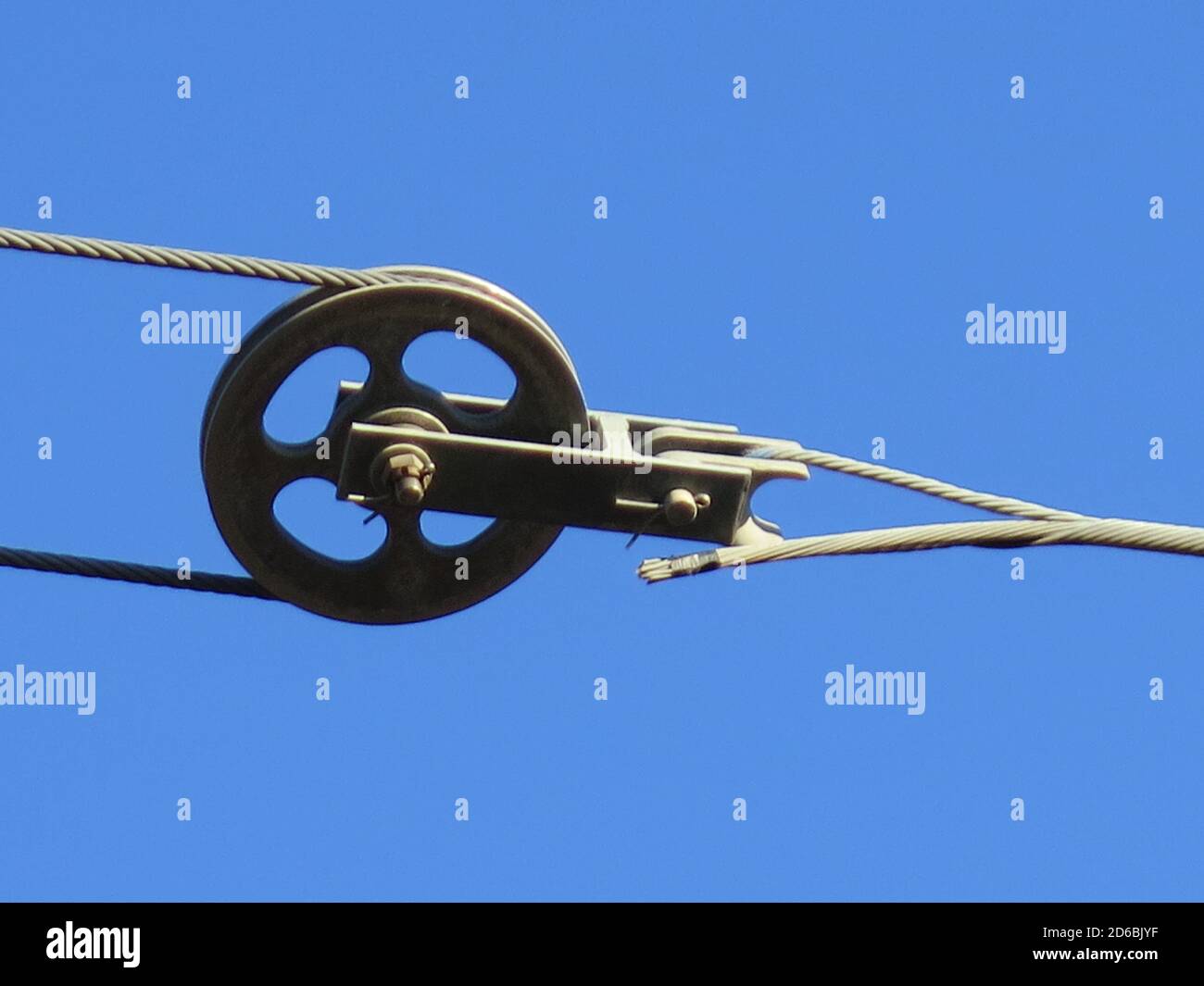 small Railway overhead electric line Tension wheel Stock Photo - Alamy