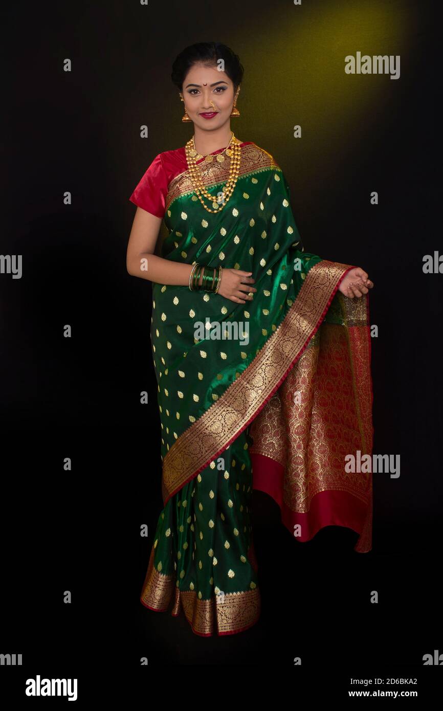 Indian model wearing traditional Maharashtrian bridal green sari and ...