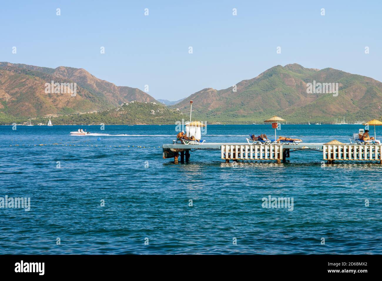 Seascape in the area of Marmaris Turkey. people sunbathing and bathing ...