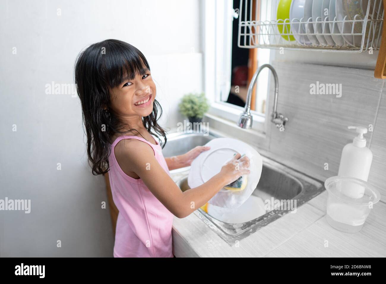 Kid Washing The Dishes