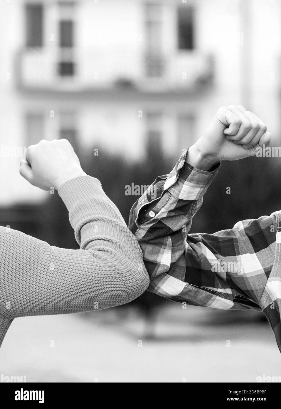 Elbow bump Black and White Stock Photos & Images - Alamy