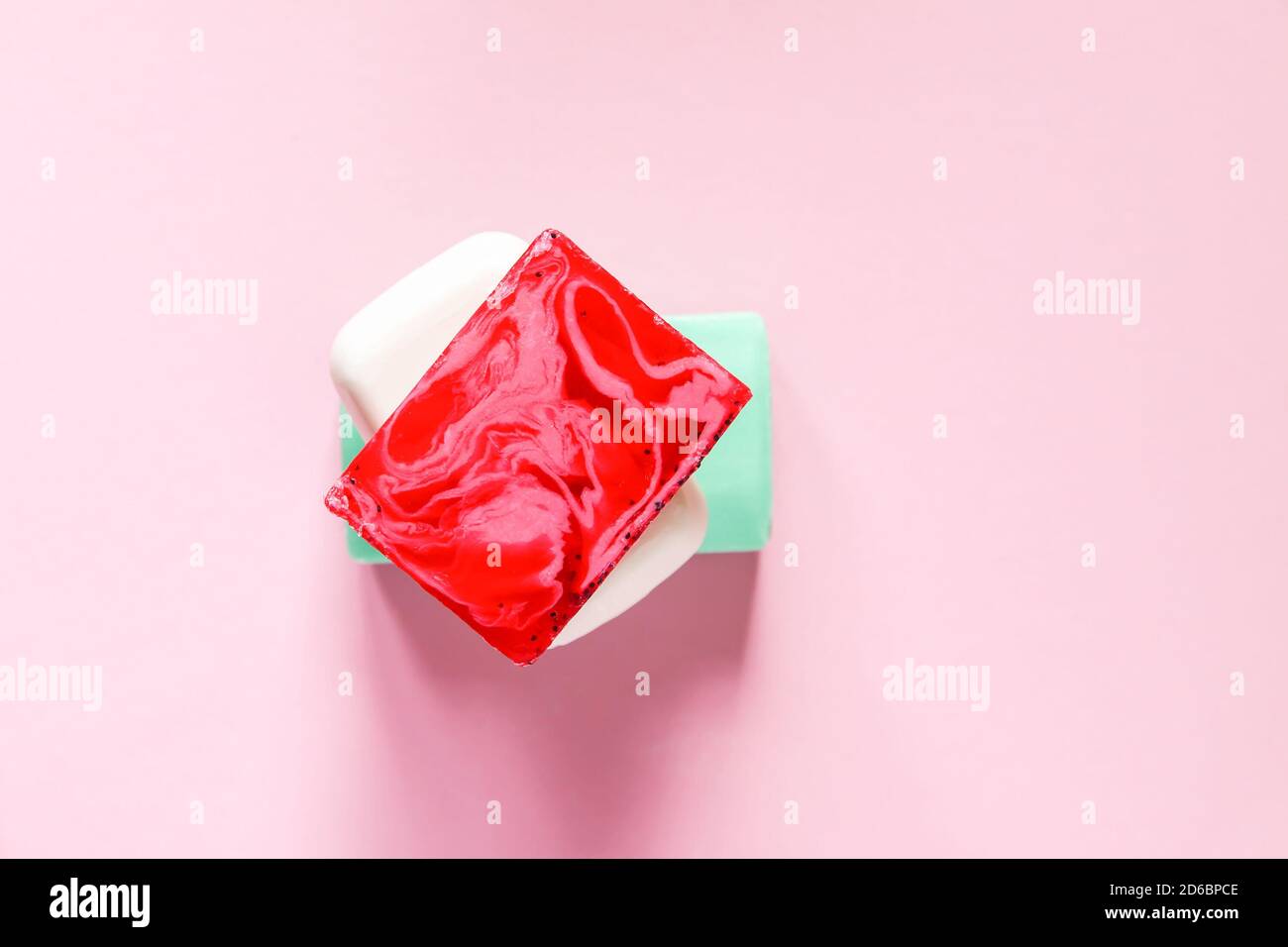 Different homemade coloful soap on soft pink background Stock Photo - Alamy