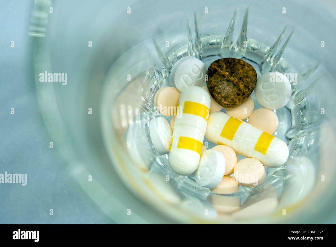 Pill and drug capsule and tablets in the glass Stock Photo - Alamy
