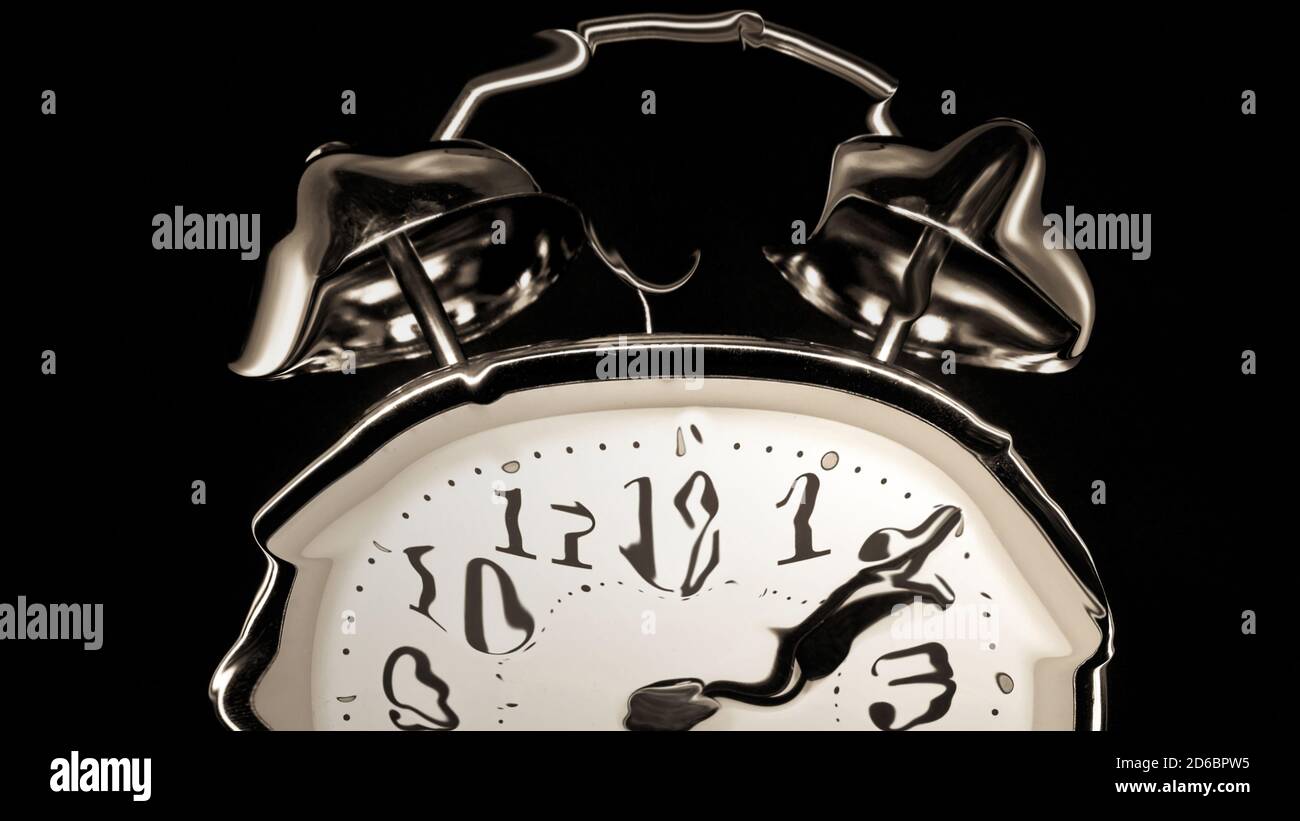retro alarm clock distorted and melting isolated on a black background ...