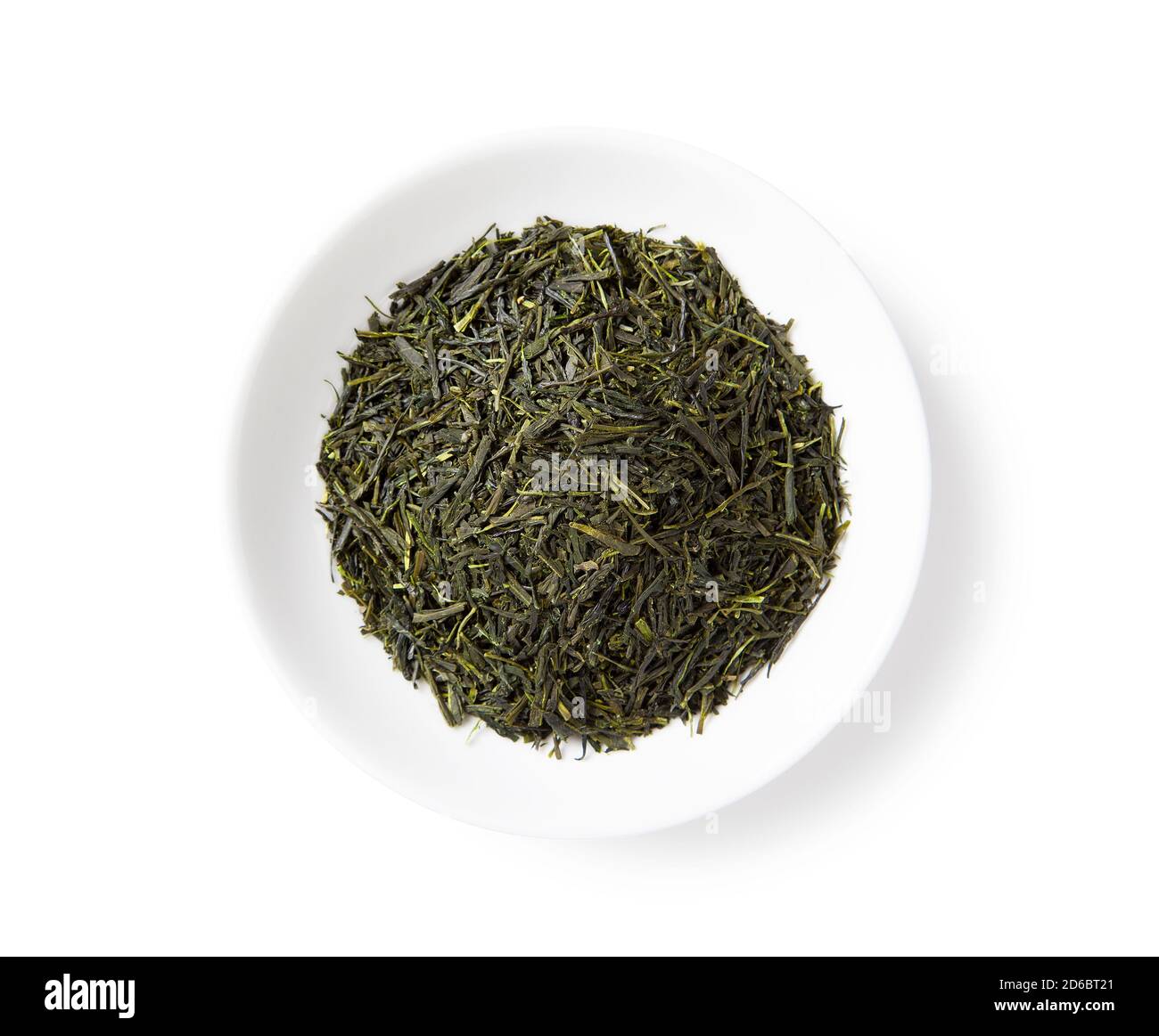 Taking a bird's eye view of tea leaves placed on a white background ...