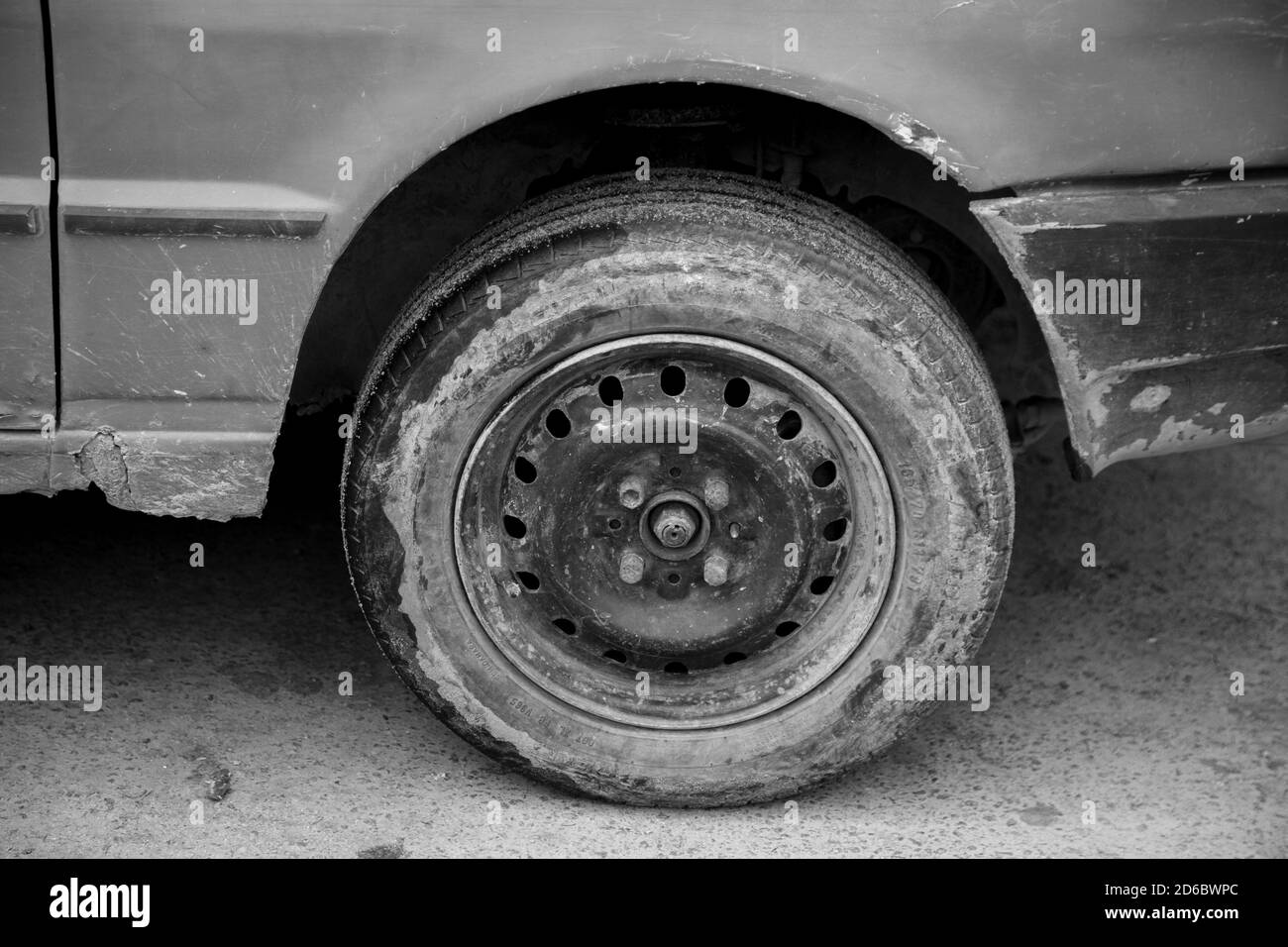 Greyscale shot of the dirty wheel of an old car Stock Photo - Alamy