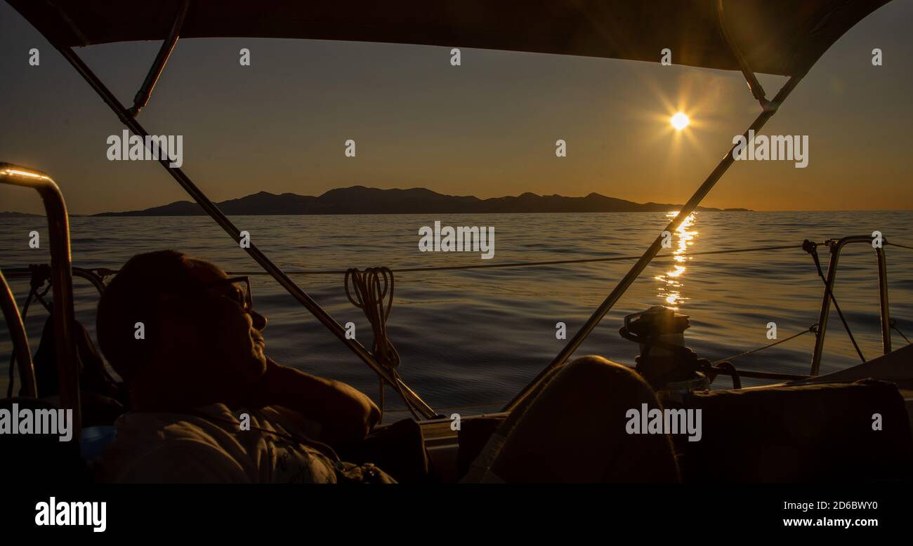 Sunset seen from a travelling sailboat,Cyclades,Greece Stock Photo - Alamy
