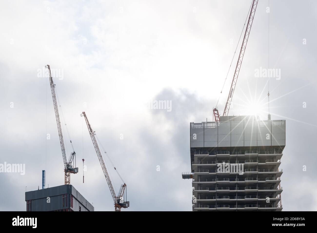 Cranes on a skyscraper construction site for modern buildings Stock ...