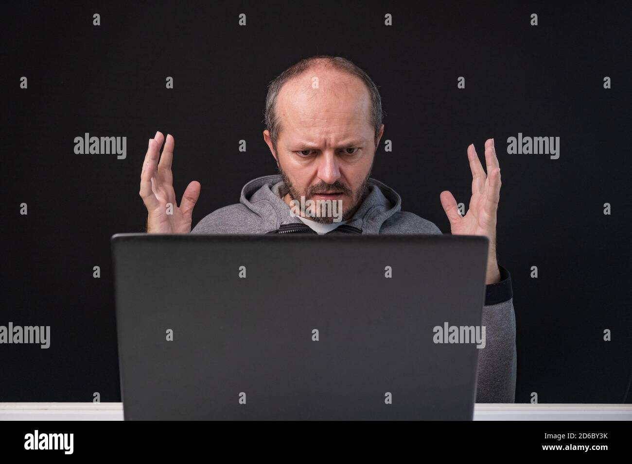 Man working from home office, angry face expression. Adult bearded ...
