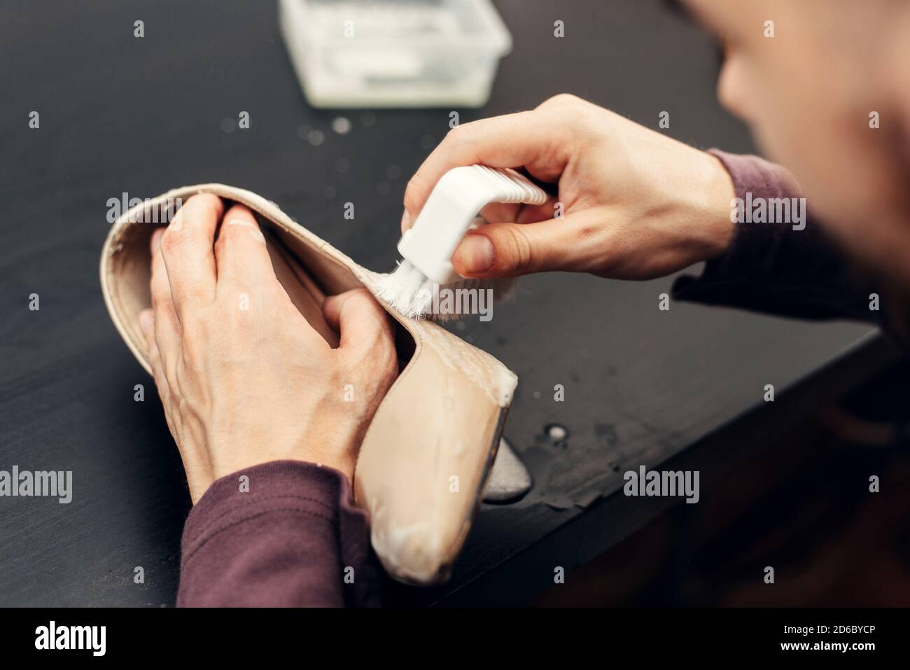 Leather shoes care concept. Shoe cleaning and polishing. Close up ...