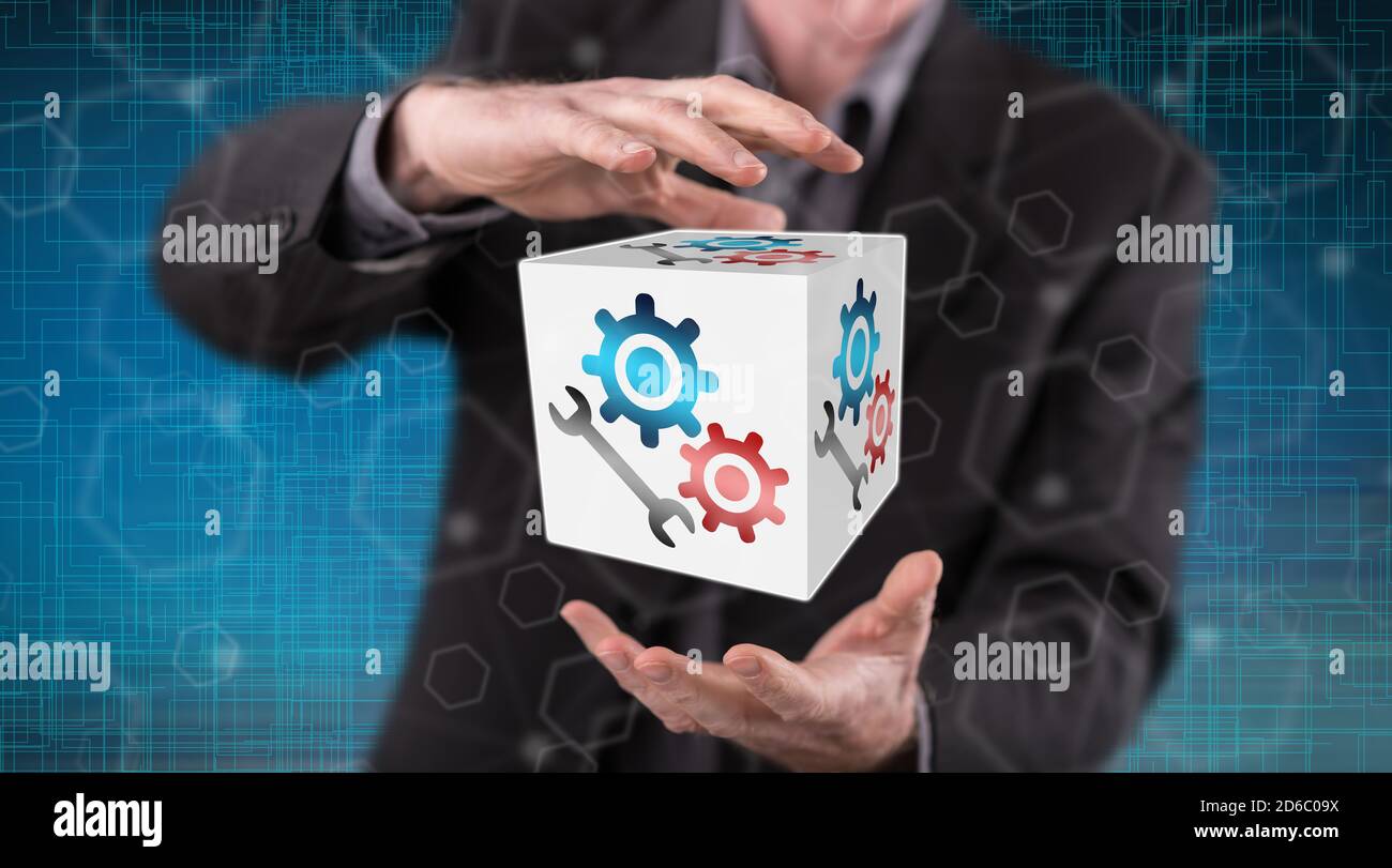 Maintenance system concept between hands of a man in background Stock ...