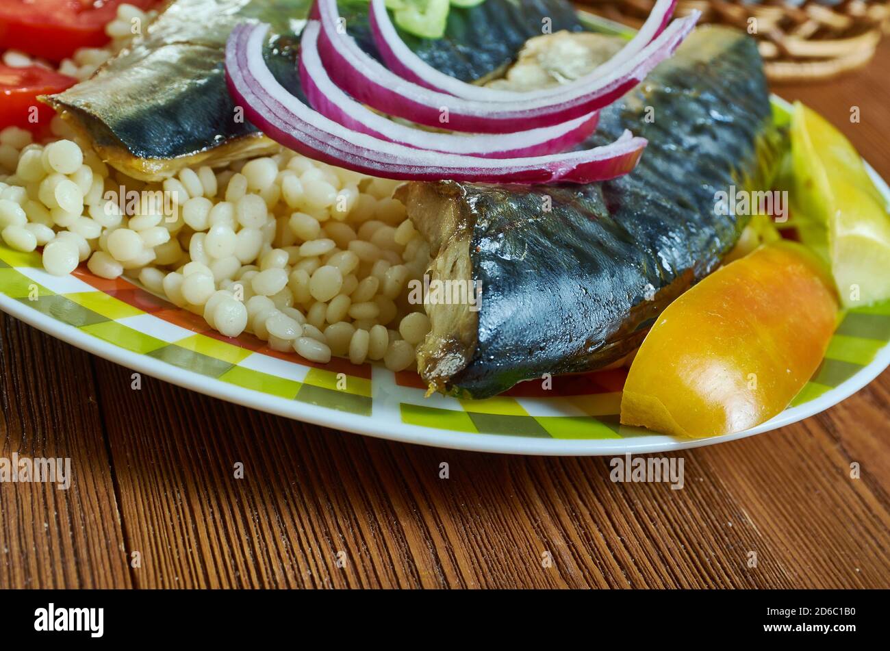 Israeli Fried mackerel fish with Ptitim close up Mediterranean cuisine ...