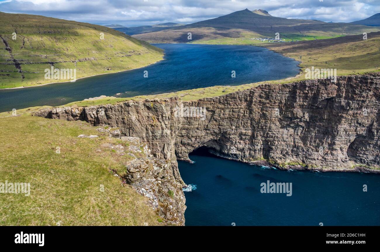 Iconic lake and ocean cliffs in Faroe Islands Stock Photo - Alamy