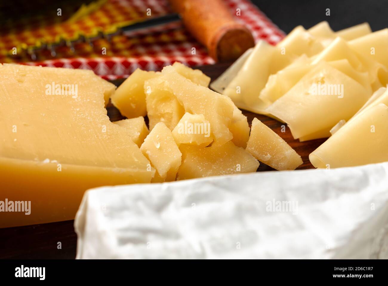 Cut pieces of hard cheese close up Stock Photo - Alamy