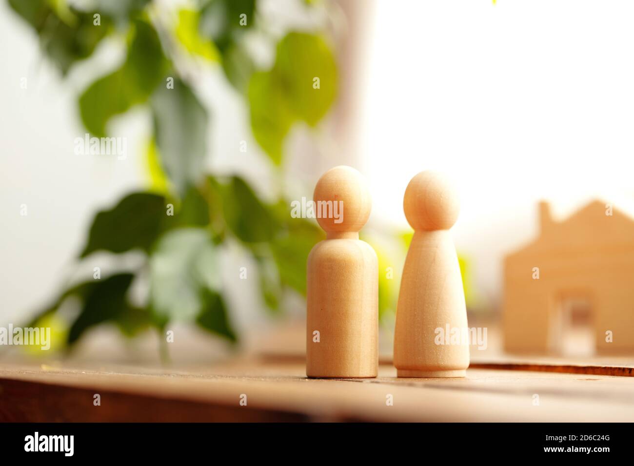 Wooden men figures and toy wooden house Stock Photo - Alamy