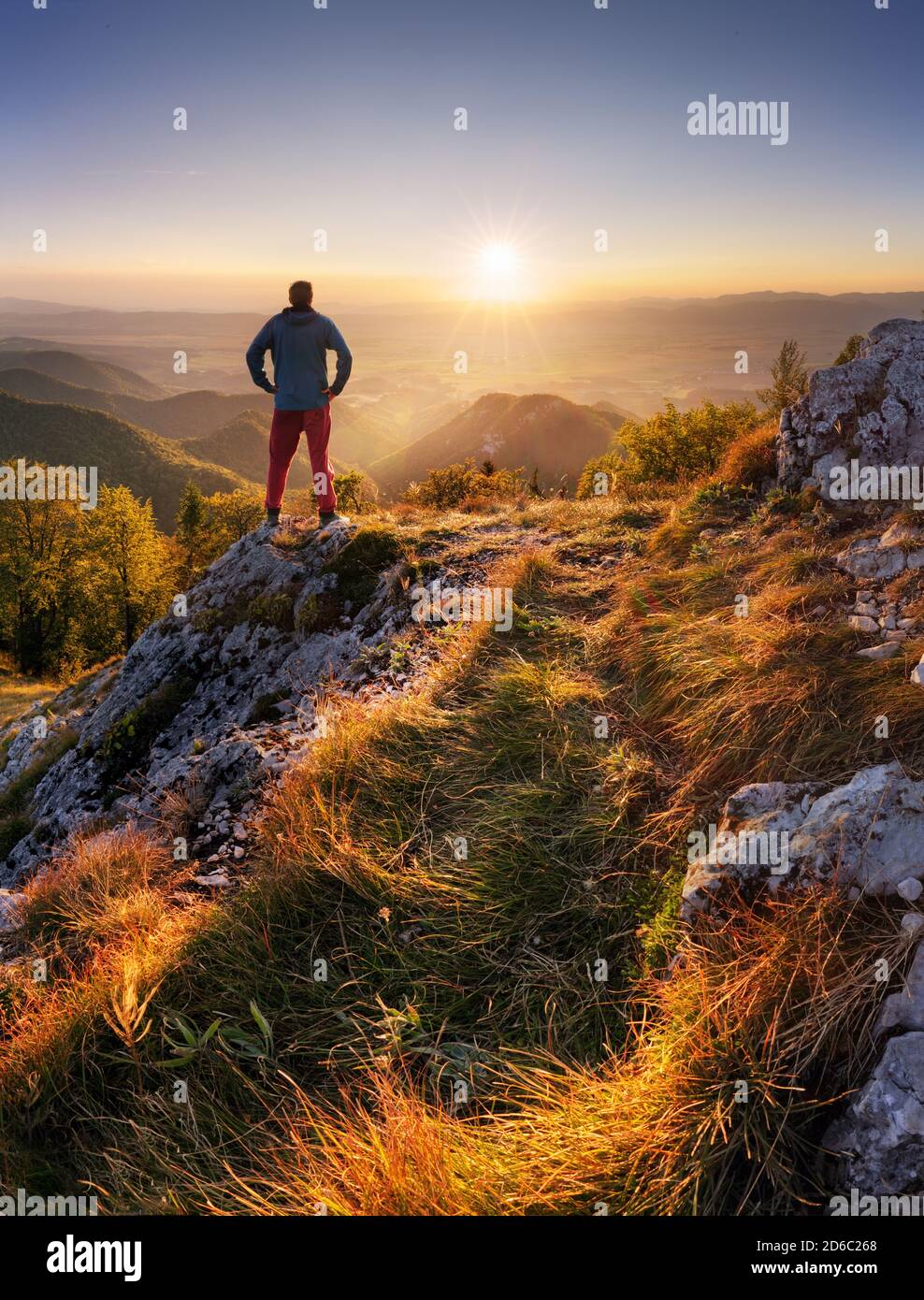 Back view silhouette of young tourist traveler man standing with ...