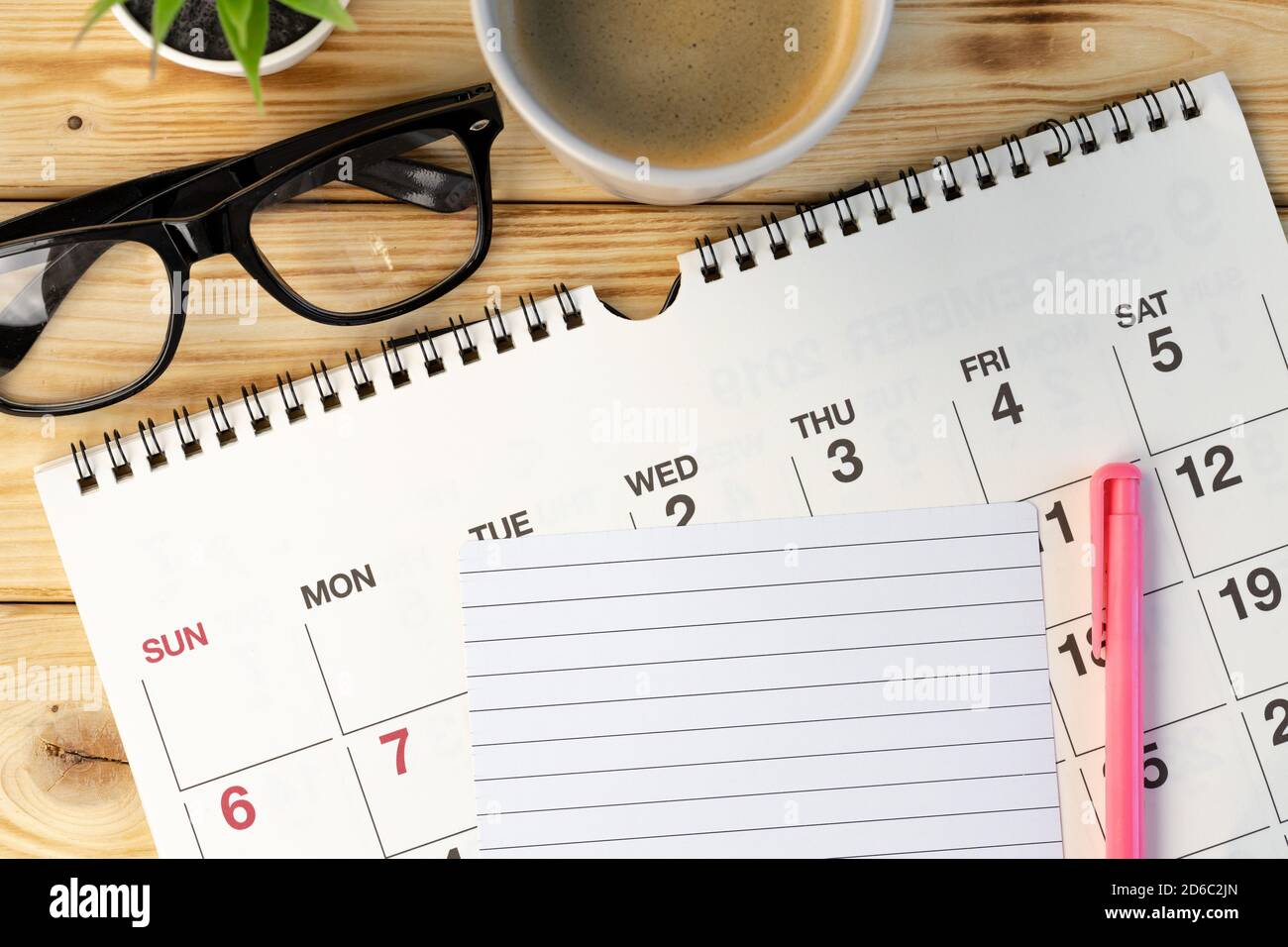Calendar page close up on office desk Stock Photo - Alamy
