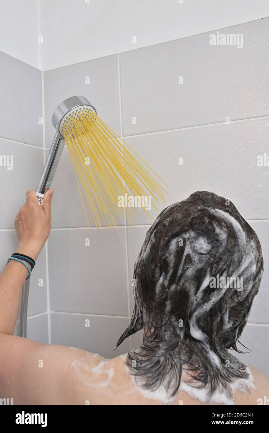 Abstract Woman Hand With Silver Shower and Pasta Spaghetti like Water ...