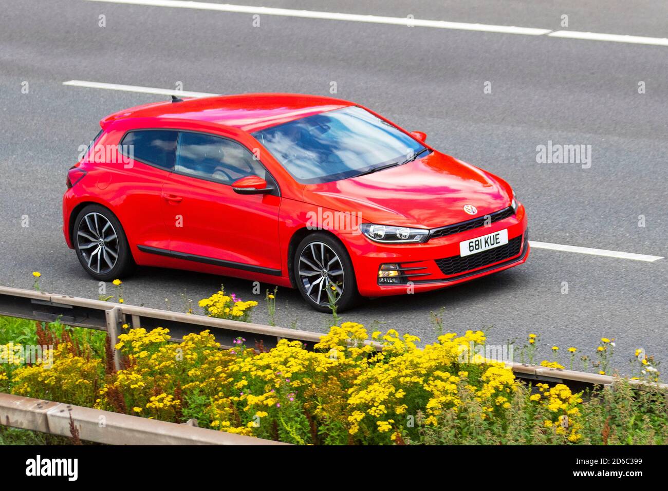 2015 red VW Volkswagen Scirocco GT Bluemotion Tech; Vehicular traffic, moving vehicles, cars ...