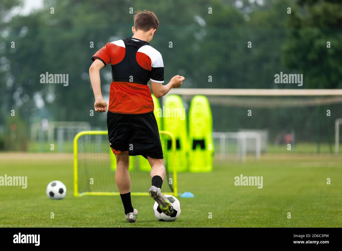 Teenager on Football Training with Ball. Youth Footballer Practicing on ...