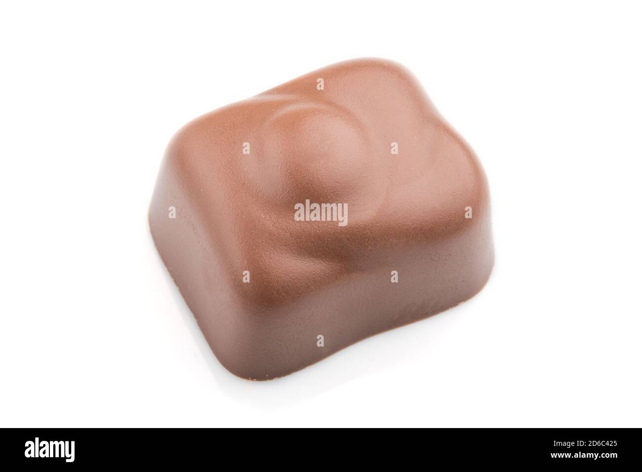 Single chocolate candy isolated on white background. side view, close ...