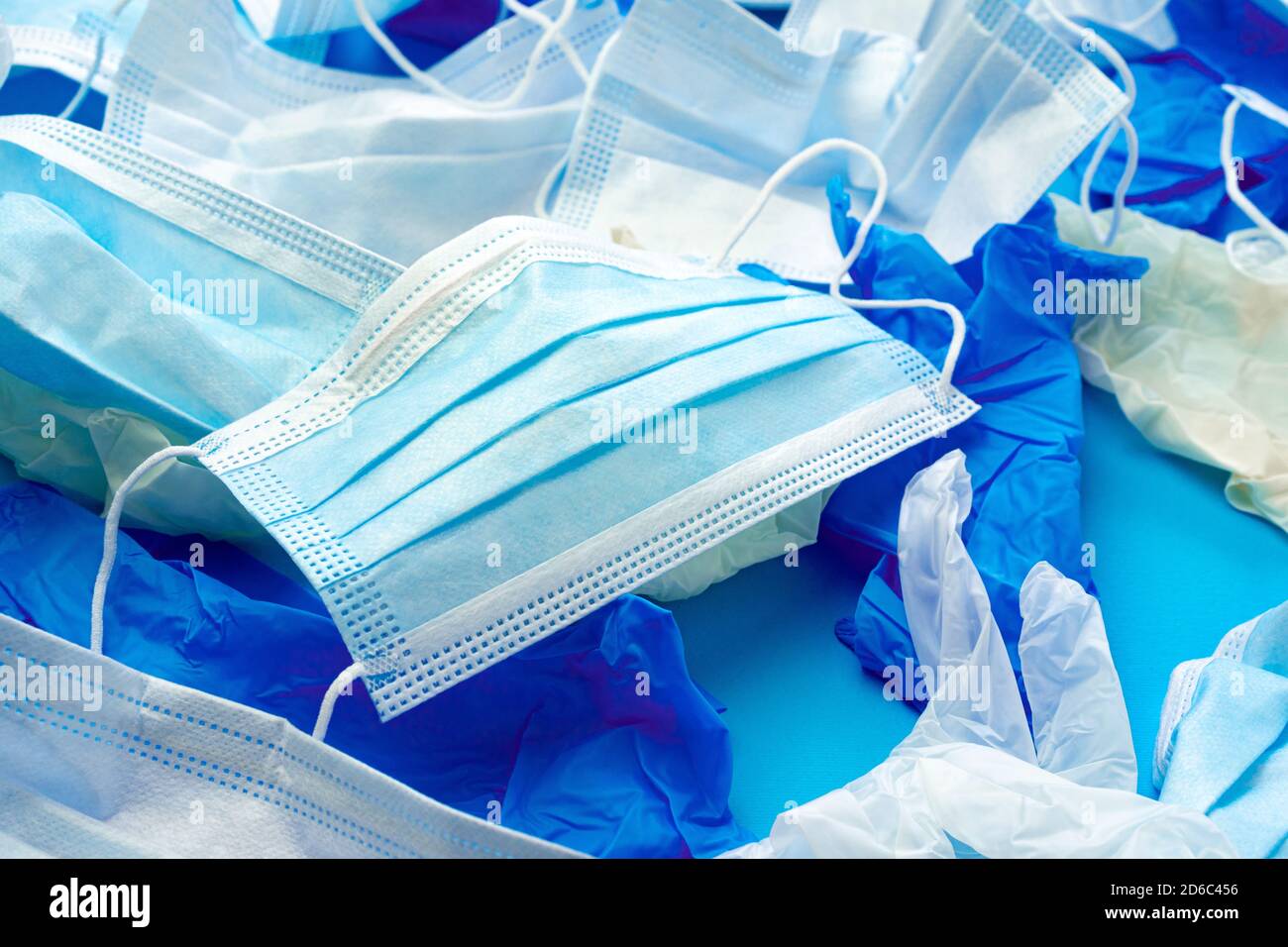 Coronavirus protection equipment in medical waste bin. Used face masks ...