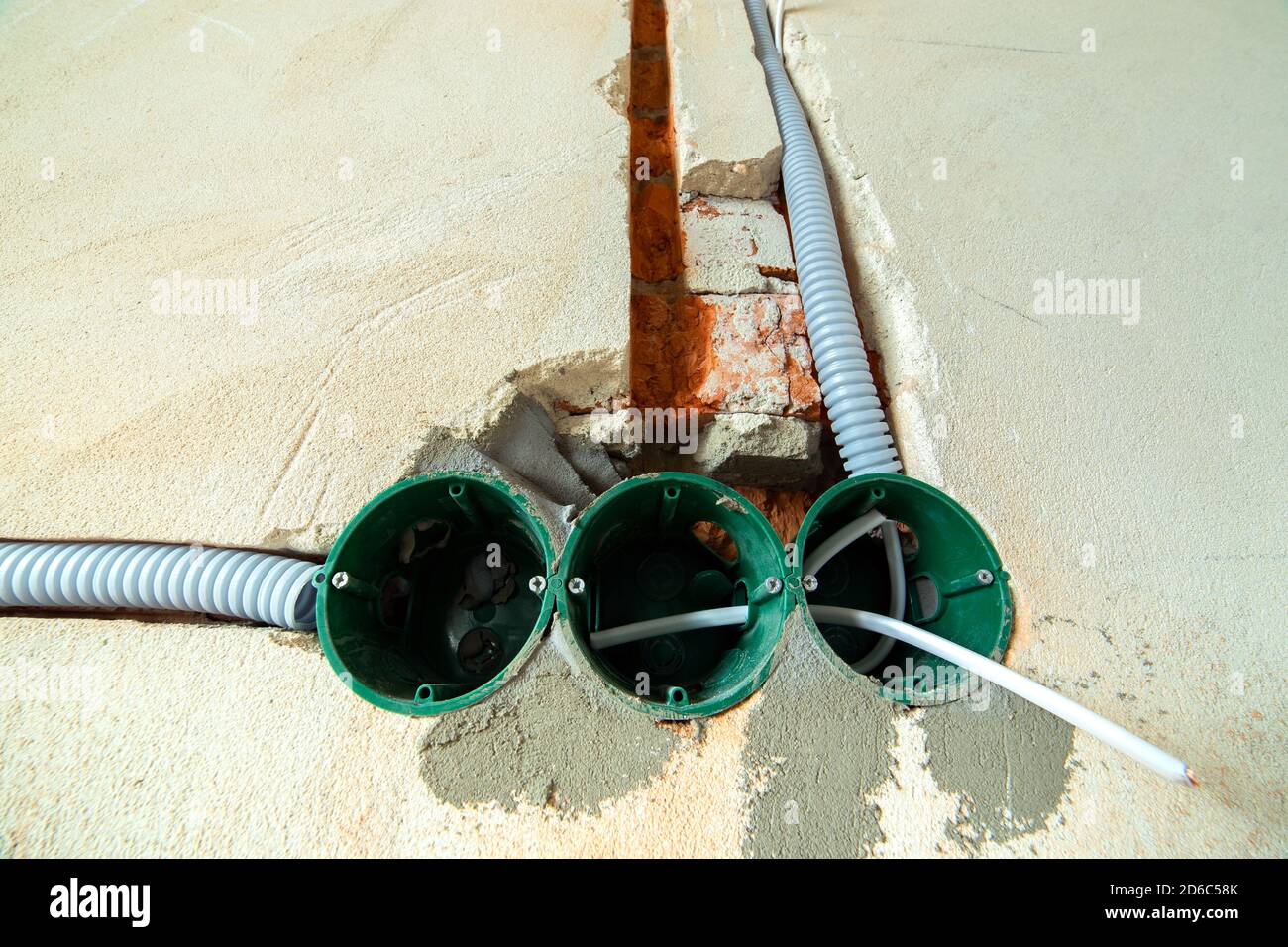 New electrical wiring installation, plastic boxes and electrical cables ...