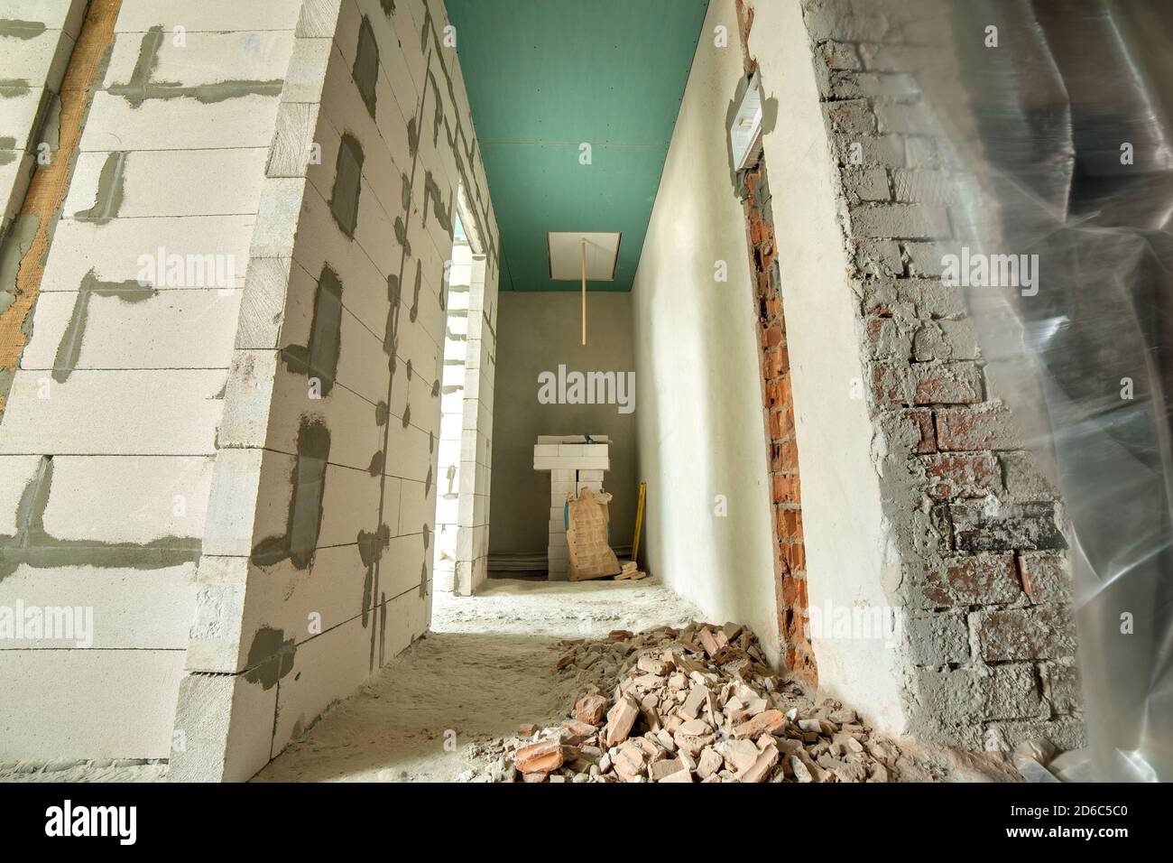 Interior of an apartment room with bare walls and ceiling under ...