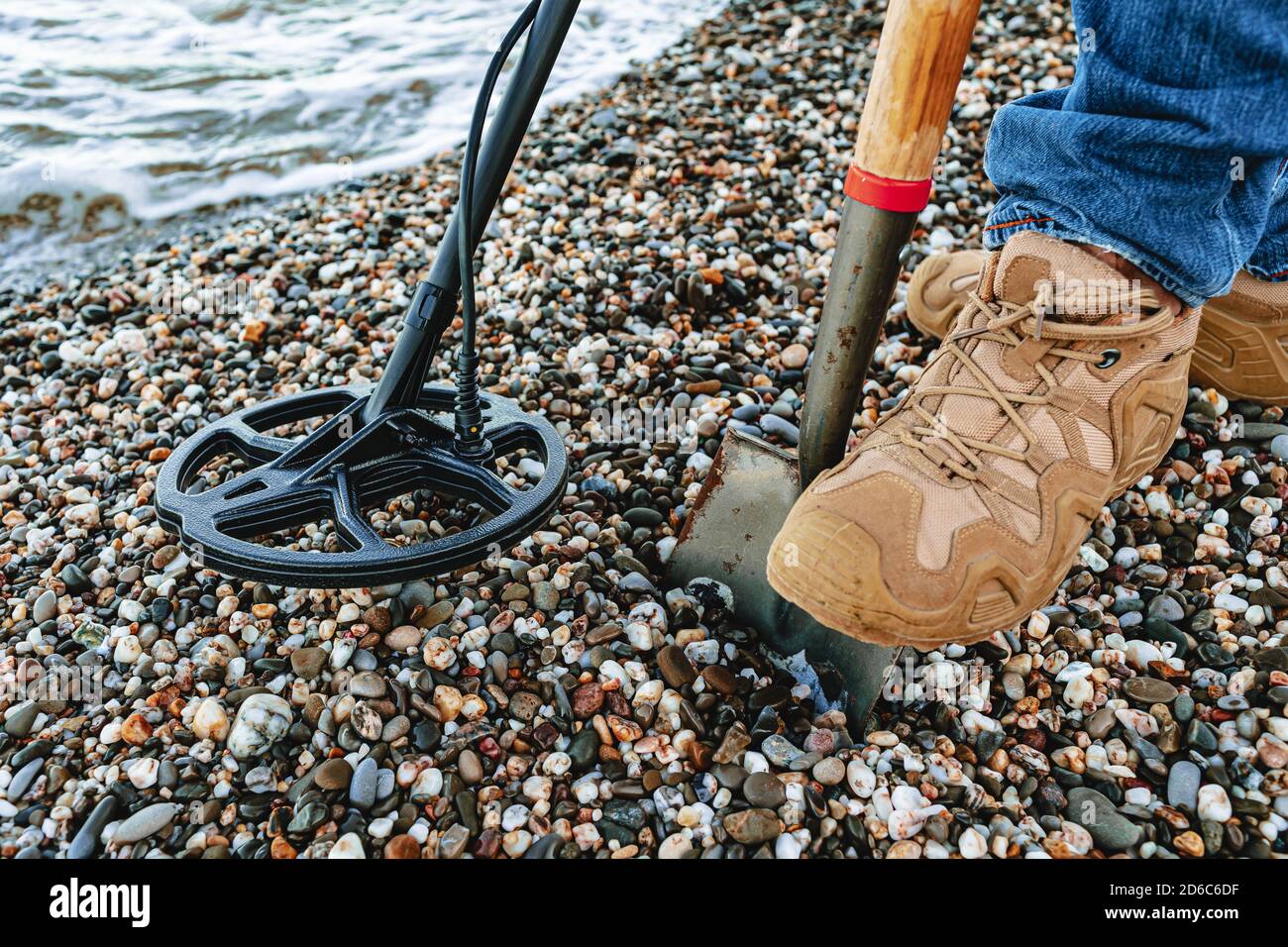 Metal detector coil in action above the ground Stock Photo - Alamy
