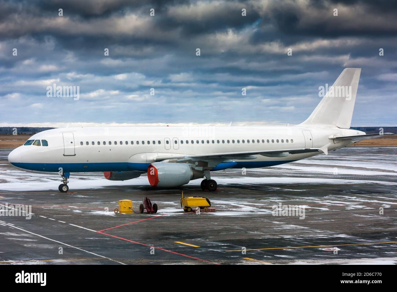Passenger airplane with shrouded engines at the airport apron Stock ...