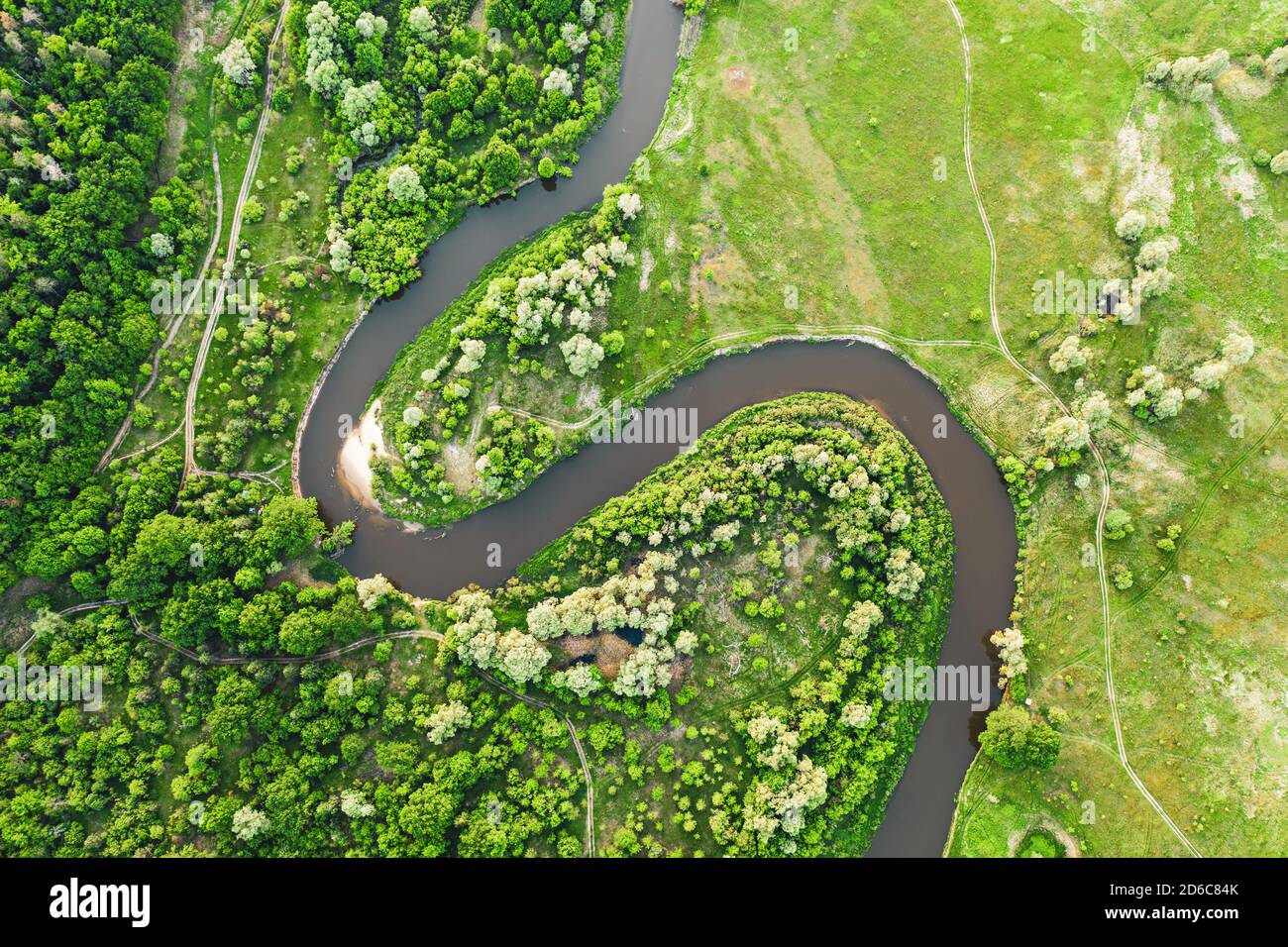 Aerial landscape of winding river in green field, top view of beautiful ...
