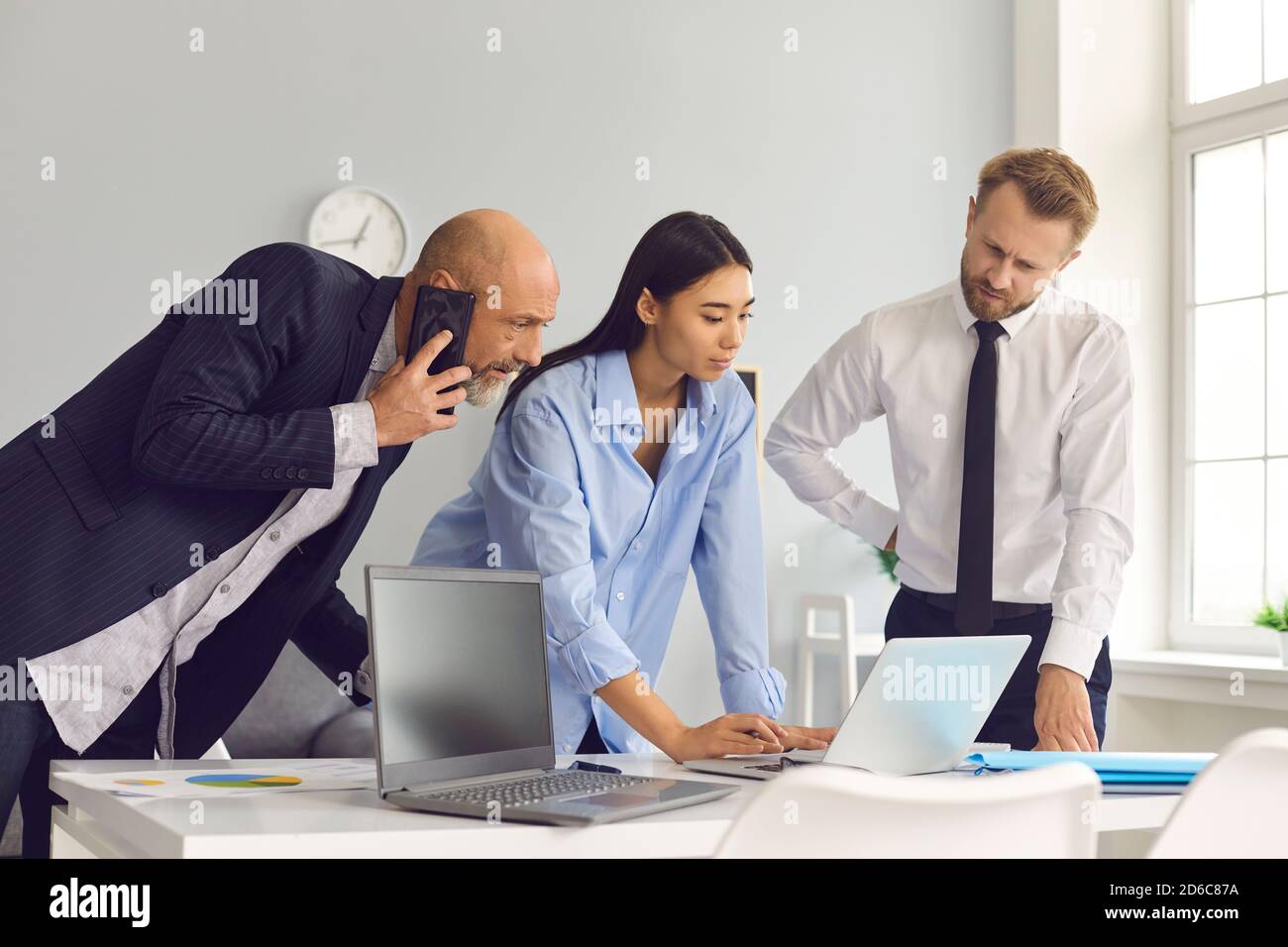 Diverse group of business professionals working together in company ...