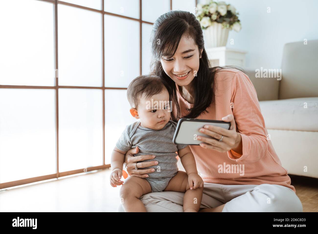 Cute baby using phone adorable hi-res stock photography and images - Alamy
