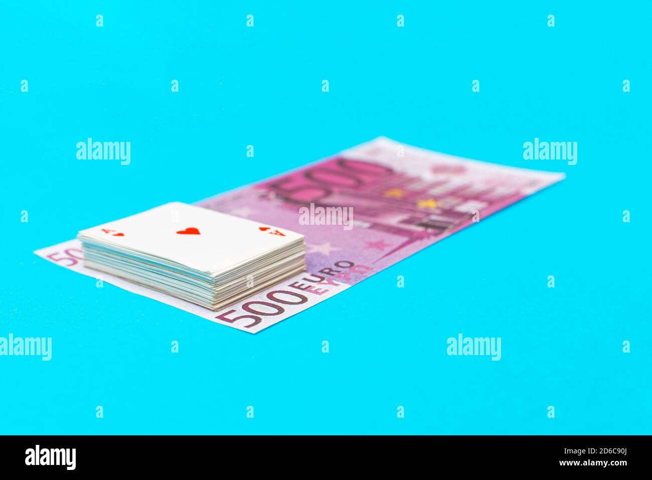 500 Euro With One Note and small toy playing cards lie on banknote blue ...