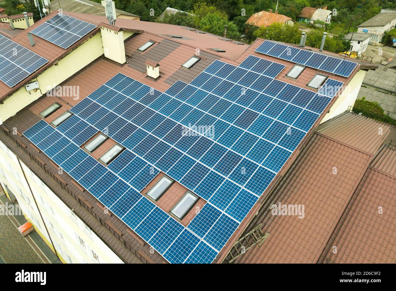 Aerial view of solar power plant with blue photovoltaic panels mounted ...