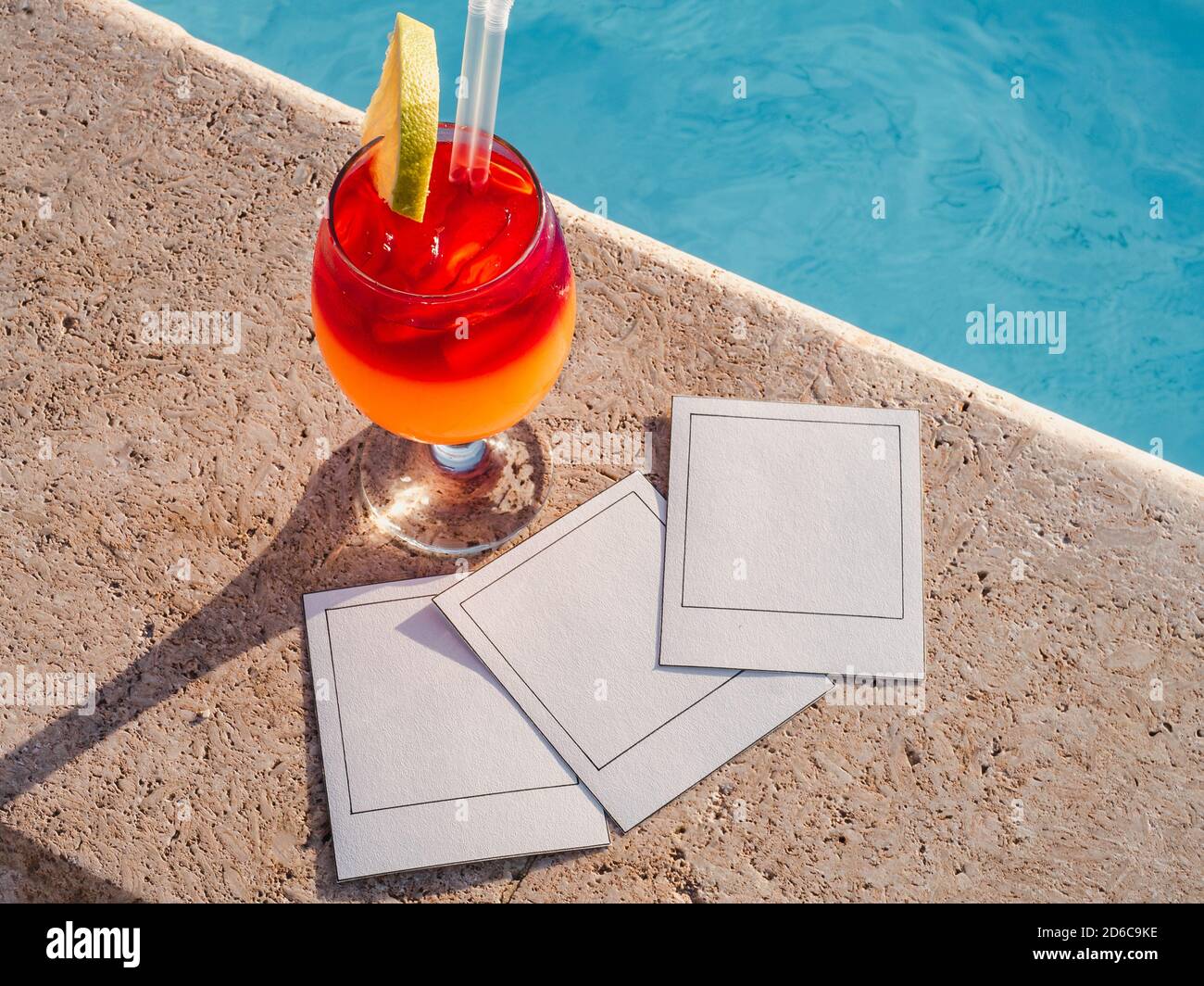Glass of a red wine on the background of the pool Stock Photo - Alamy