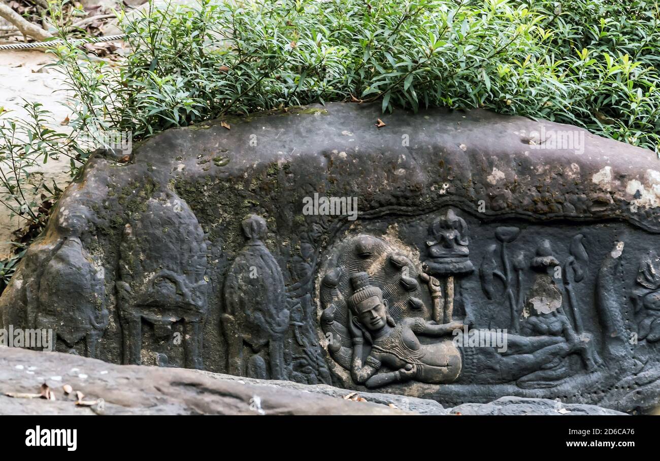Lord Vishnu in a reclining repose lying on the serpent god Ananta, with ...