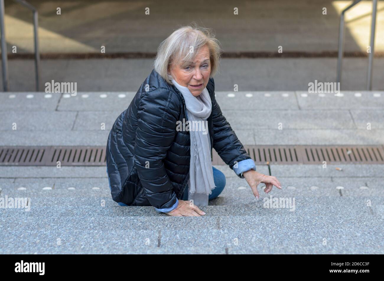 Helpless senior woman falling down steps and looking irritated Stock ...