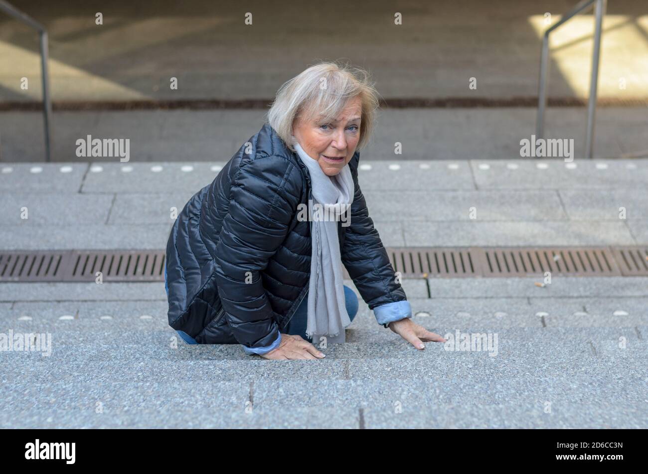 Helpless senior woman falling down steps and looking irritated Stock ...