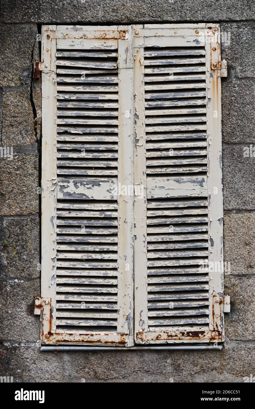 Old damaged shutter in a stone building Stock Photo - Alamy