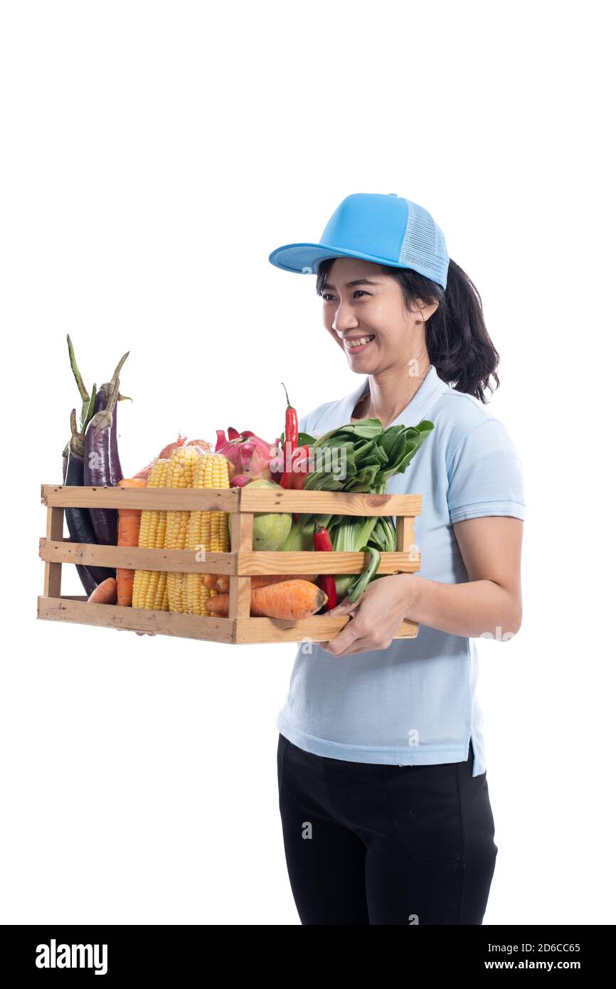female delivery courier bring groceries in the bag Stock Photo - Alamy