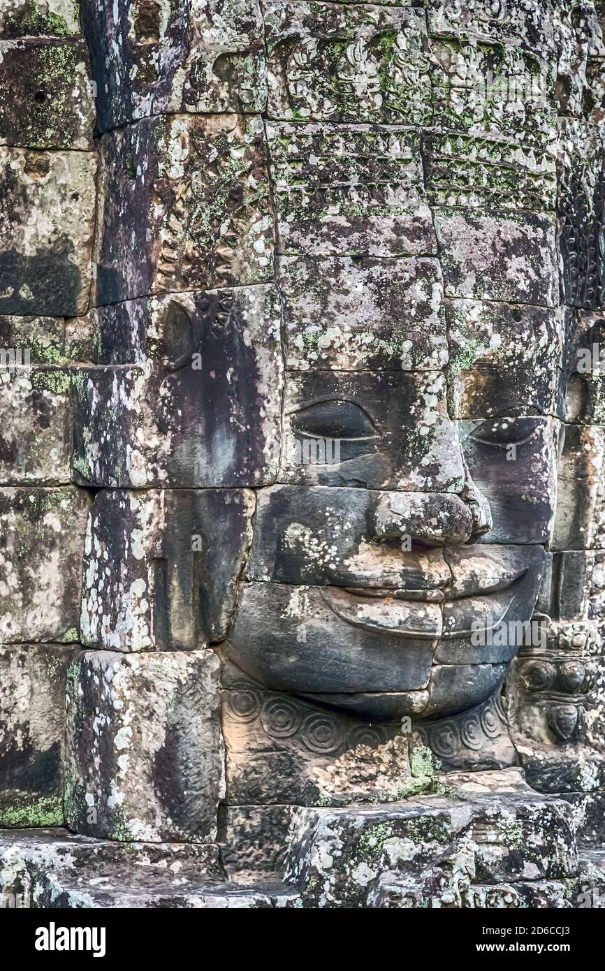 Stone bas relief face statue smiling Buddha Stock Photo - Alamy
