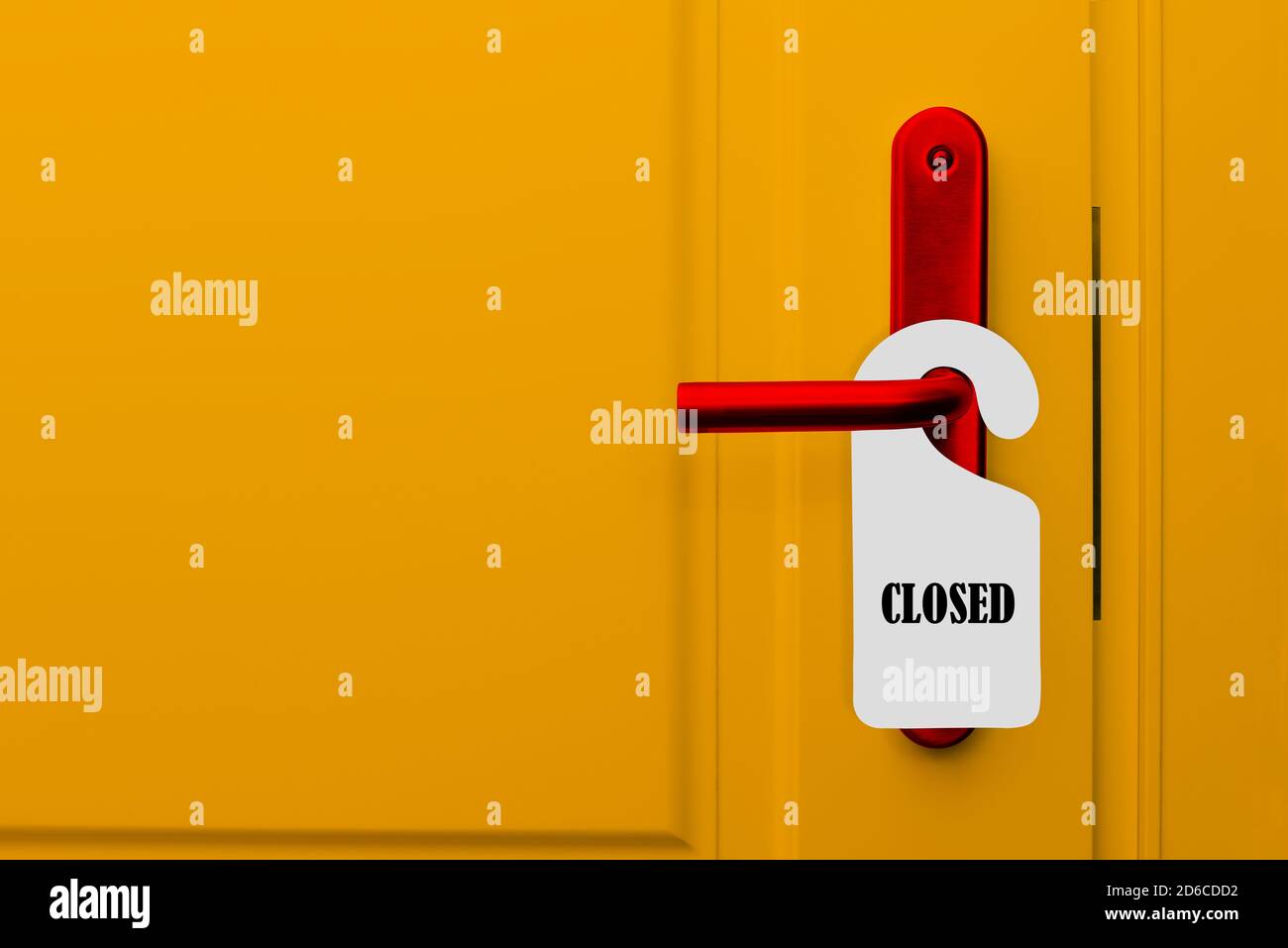 Closed door with a closed sign. Yellow door of a hotel, restaurant or ...