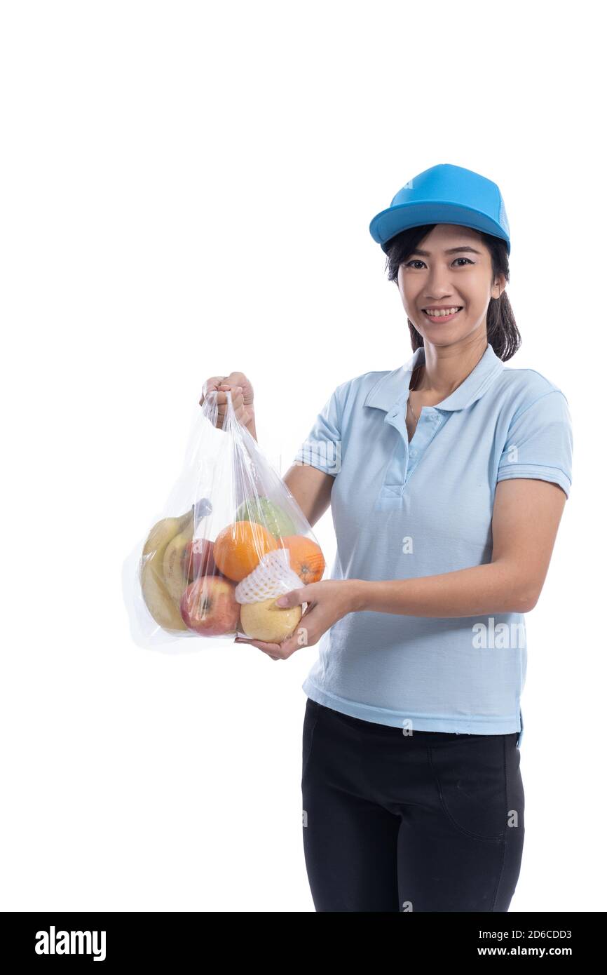 female delivery courier bring groceries in the bag Stock Photo - Alamy