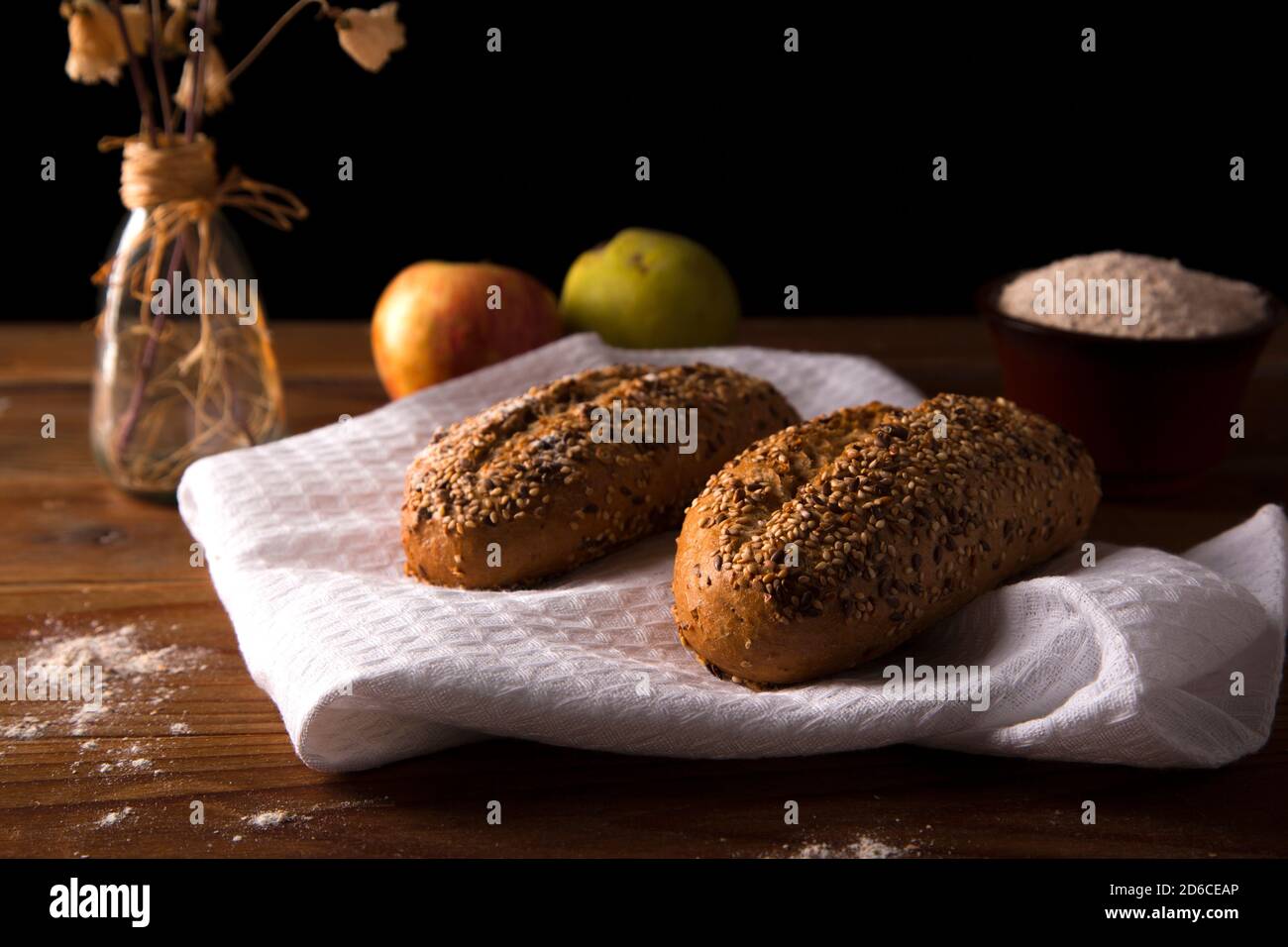 multigrain wholemeal bread with seeds on brown wooden table Stock Photo ...