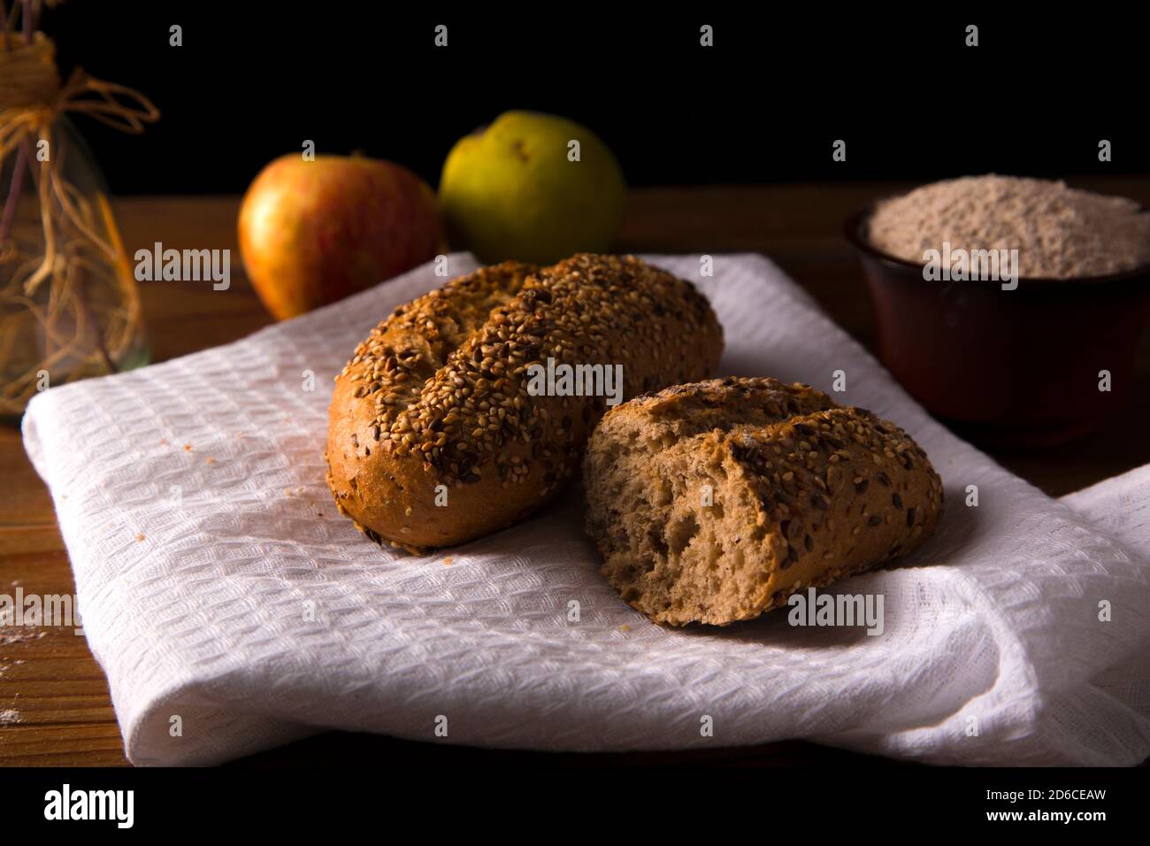 multigrain wholemeal bread with seeds on brown wooden table Stock Photo ...