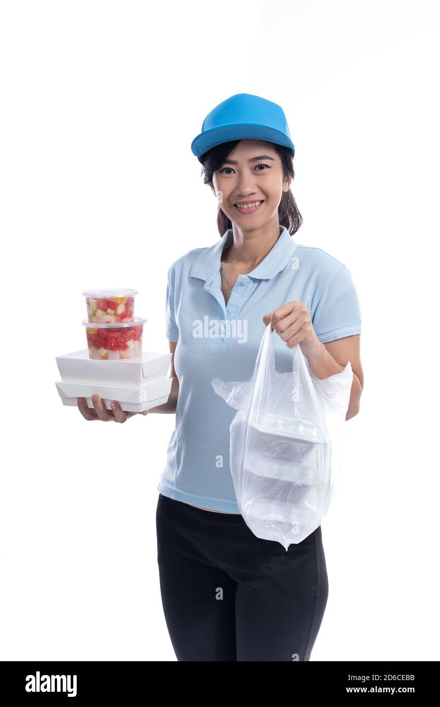 female delivery courier bring groceries in the bag Stock Photo - Alamy