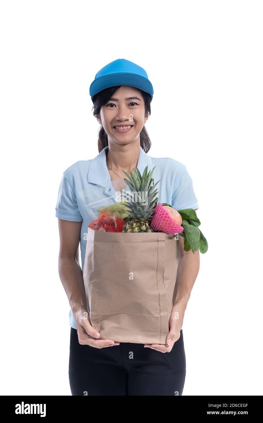 female delivery courier bring groceries in the bag Stock Photo - Alamy