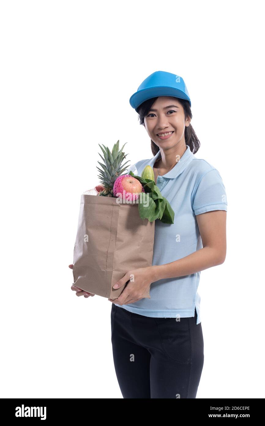 female delivery courier bring groceries in the bag Stock Photo - Alamy