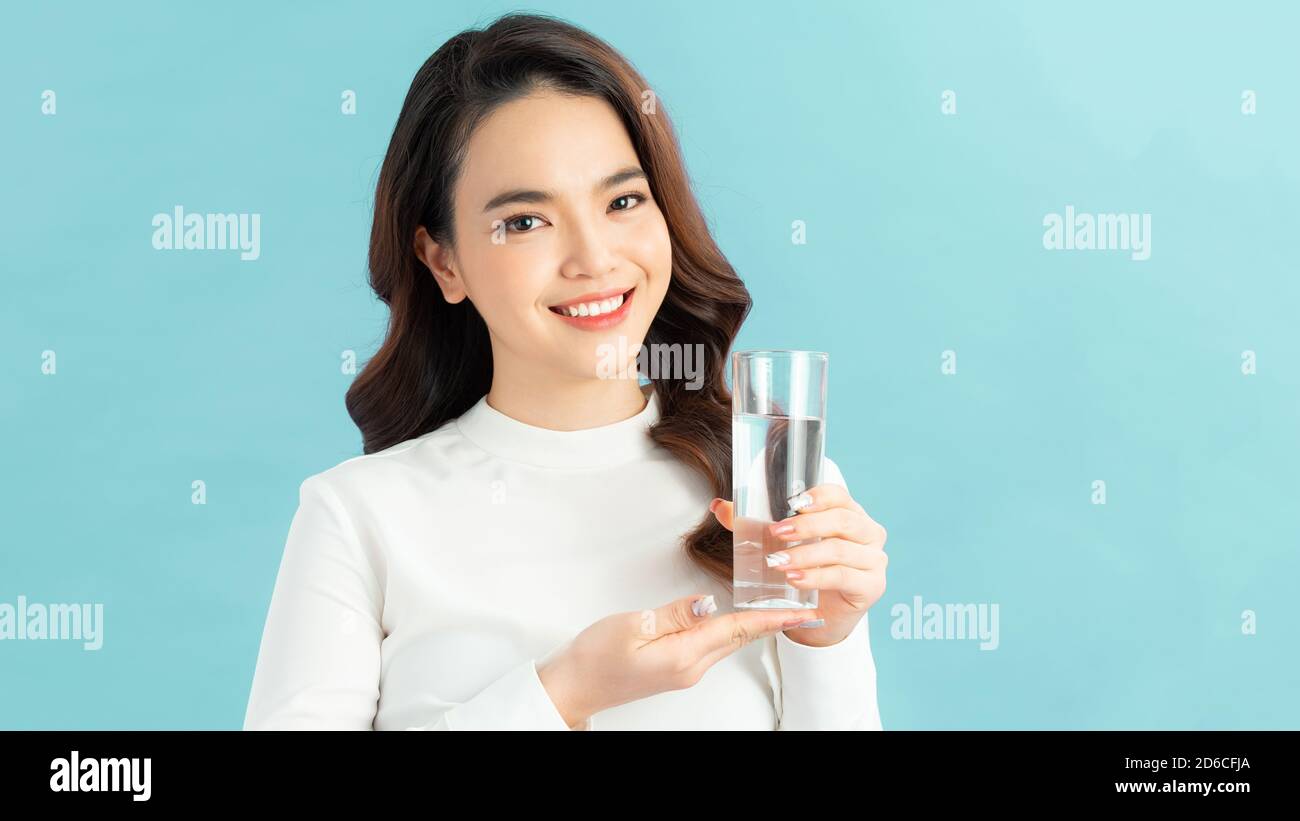 Face portrait of woman drinking water. Smiling girl. Isolated portrait ...